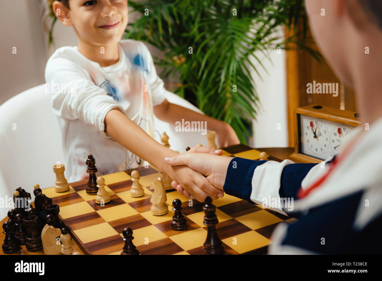 Schoolboys playing chess, having fun Stock Photo - Alamy