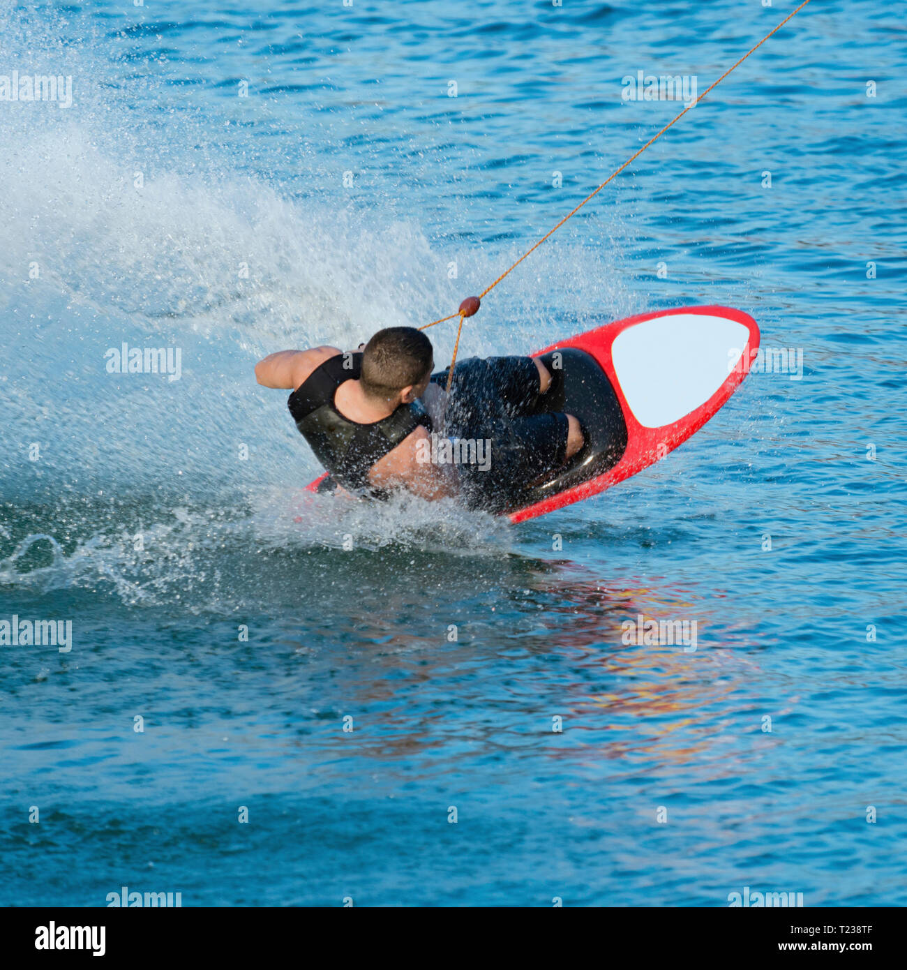 Back view of young man wakeboarding hi-res stock photography and images ...