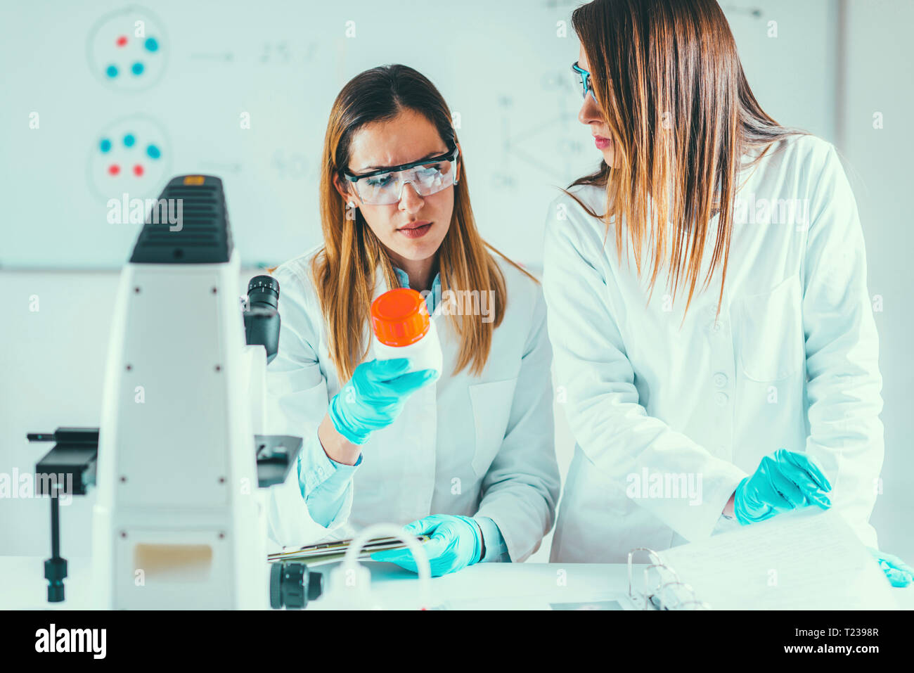 Scientific researcher taking experiment notes hi-res stock photography ...