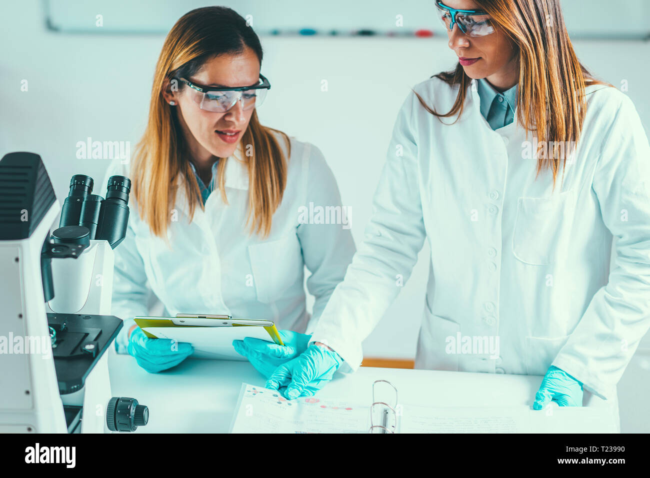 Scientific researcher taking experiment notes hi-res stock photography ...