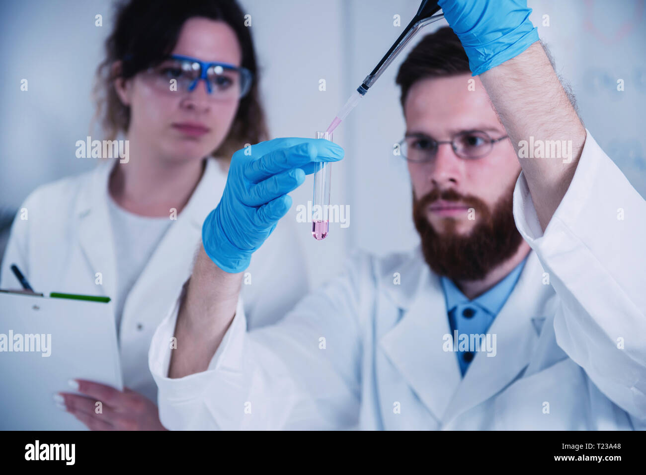 Scientist holding dropper test tube hi-res stock photography and images ...