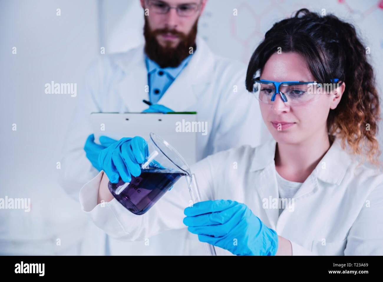 Scientist doing experiments in laboratory hi-res stock photography and ...