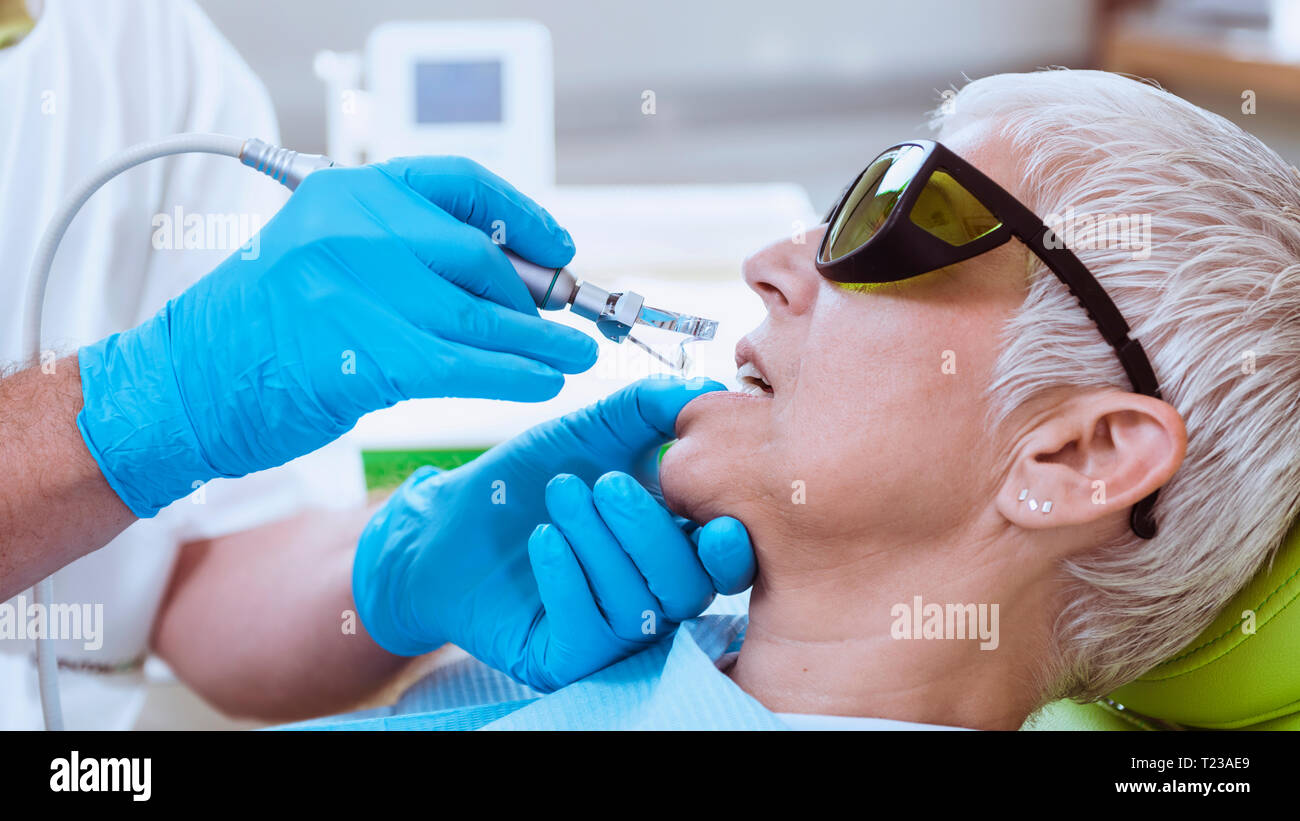 Tooth whitening treatment laser hi-res stock photography and images - Alamy
