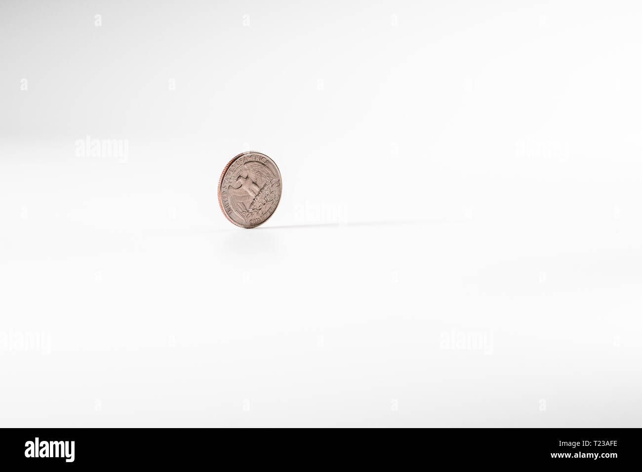 Dollar coin rotating on white background, concept of American economy ...