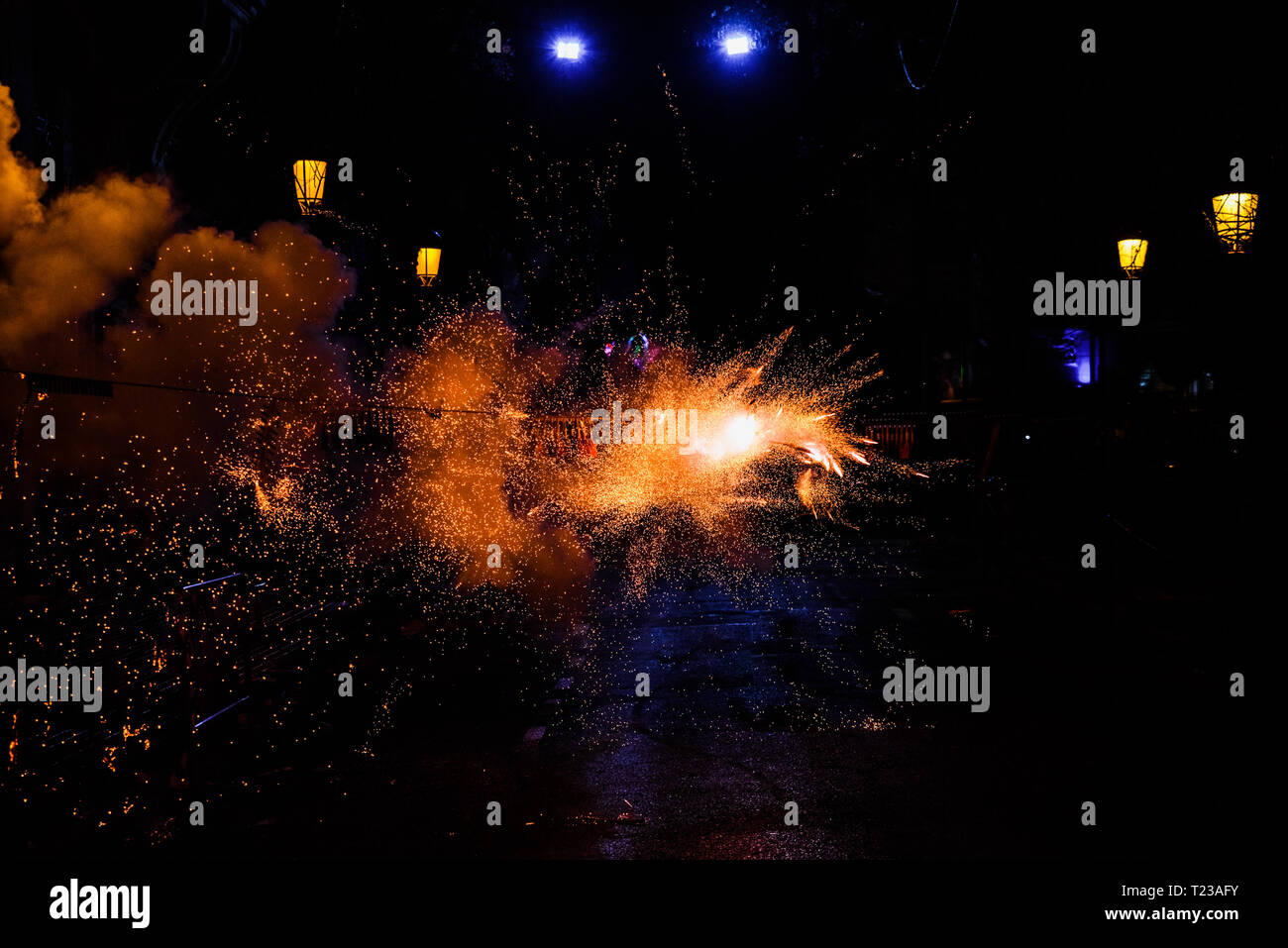 Sparks of colors in the night caused by the fire of a firecracker ...