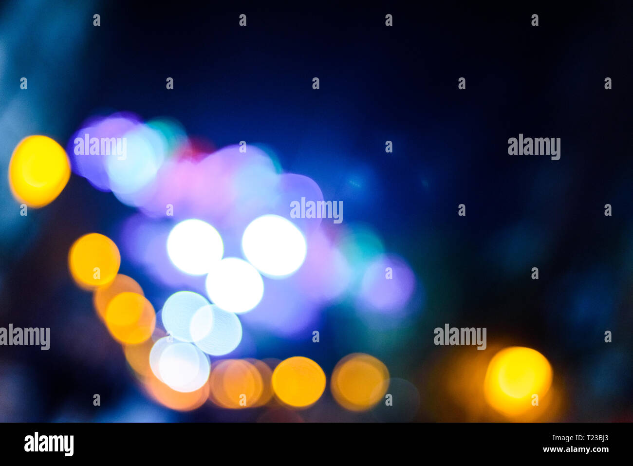 Defocused urban night background with colorful circles Stock Photo - Alamy