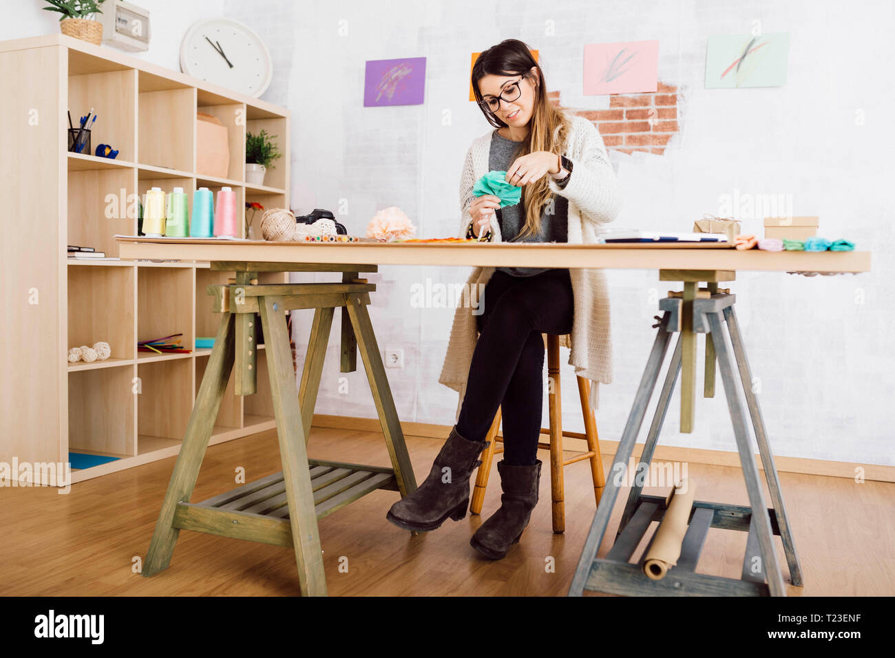 Young woman doing crafts at home, paper flowers Stock Photo - Alamy
