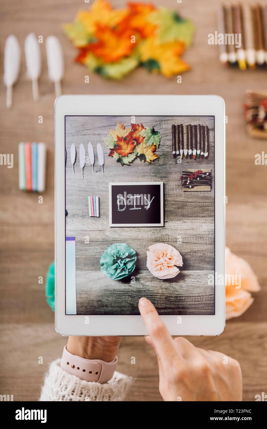 Top view of young woman making photos with the tablet for her blog of ...