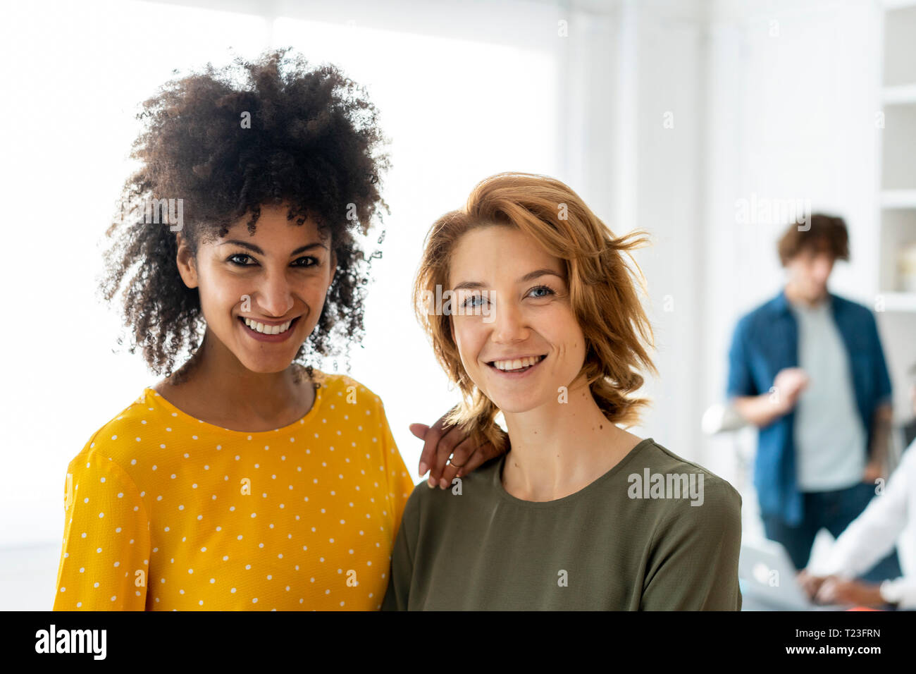 Portraits of colleagues, working together in a coworking space Stock ...