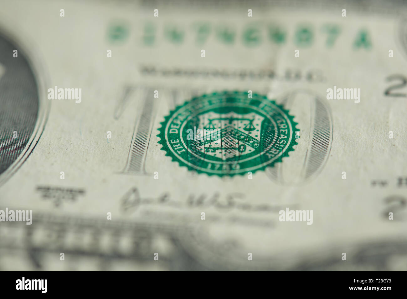 Green stamp on two dollar bill banknote close up view Stock Photo - Alamy