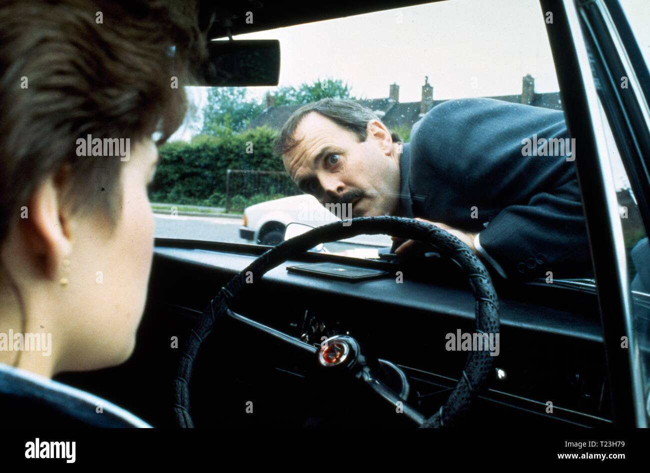 Clockwise (1986) John Cleese, Sharon Maiden, Date: 1986 Stock Photo - Alamy