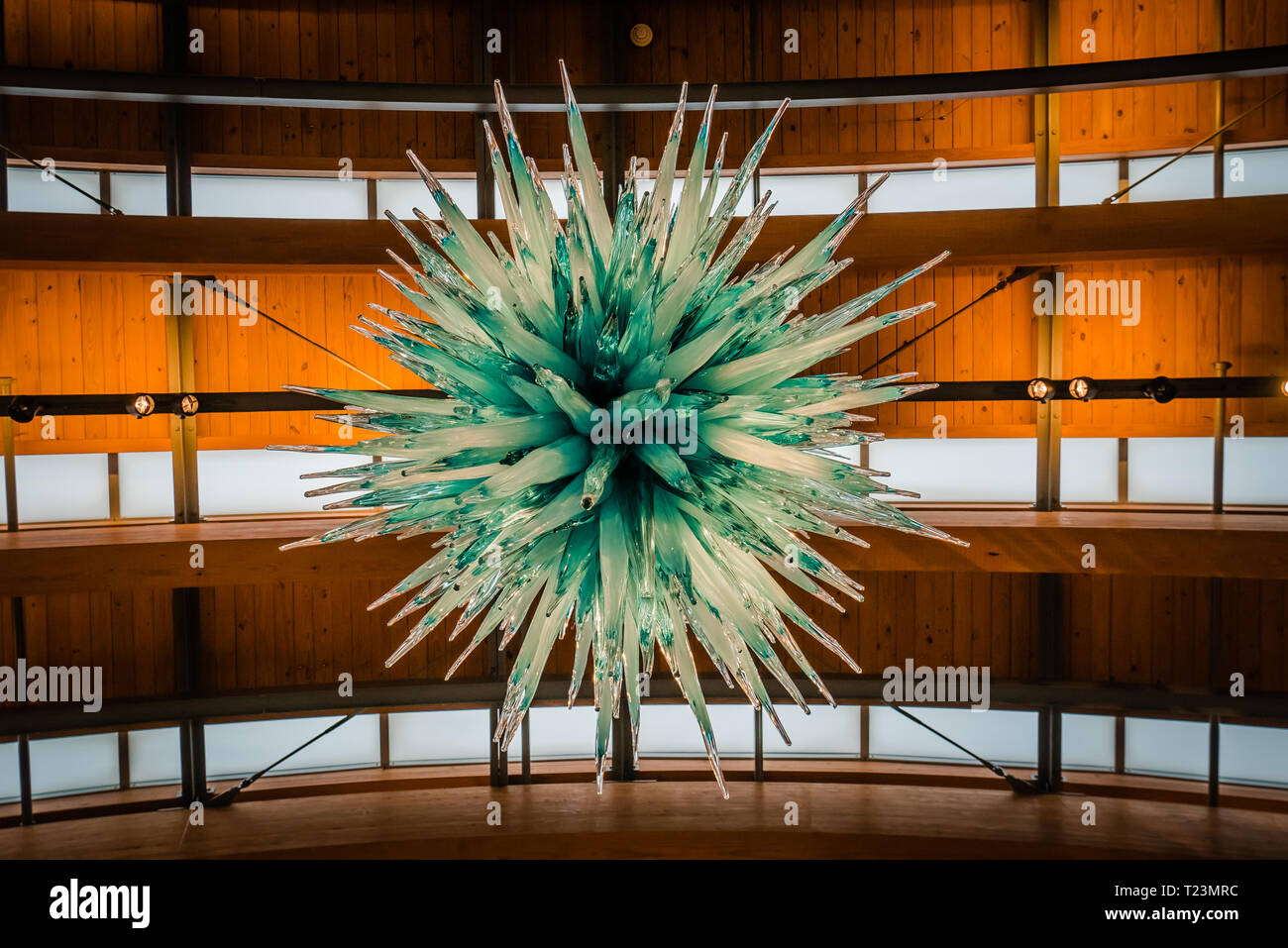 green crystal structure hanging from the top of the celing of crystal ...