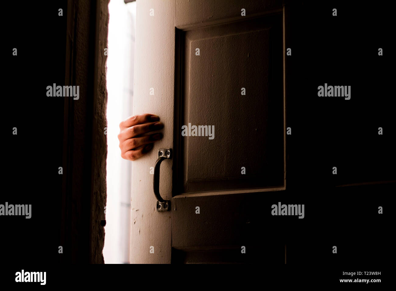 The hand on the door Stock Photo - Alamy