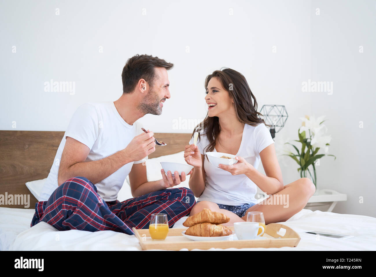 Couple breakfast bed hi-res stock photography and images - Alamy