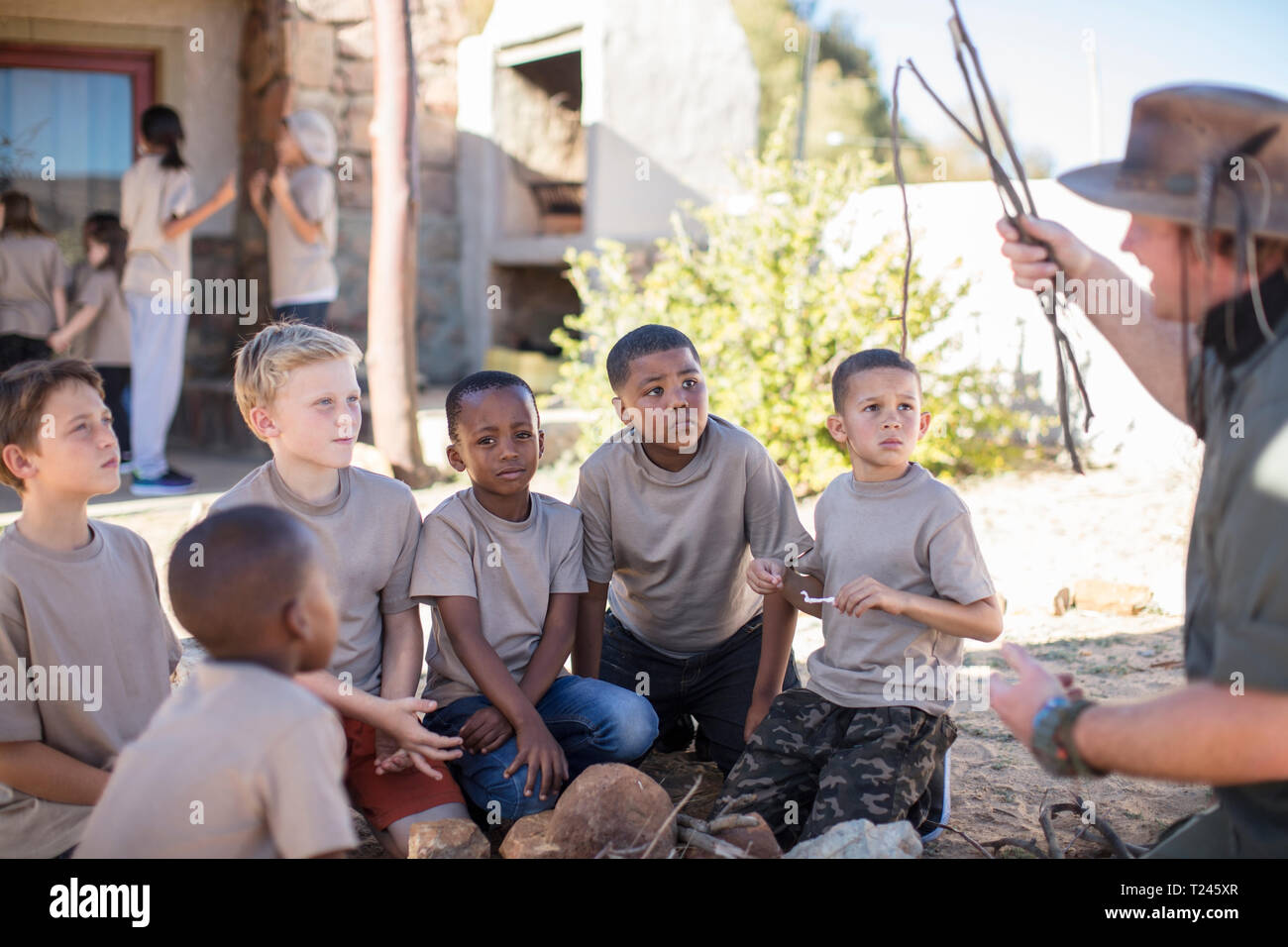 Children learning how to make a fire Stock Photo - Alamy