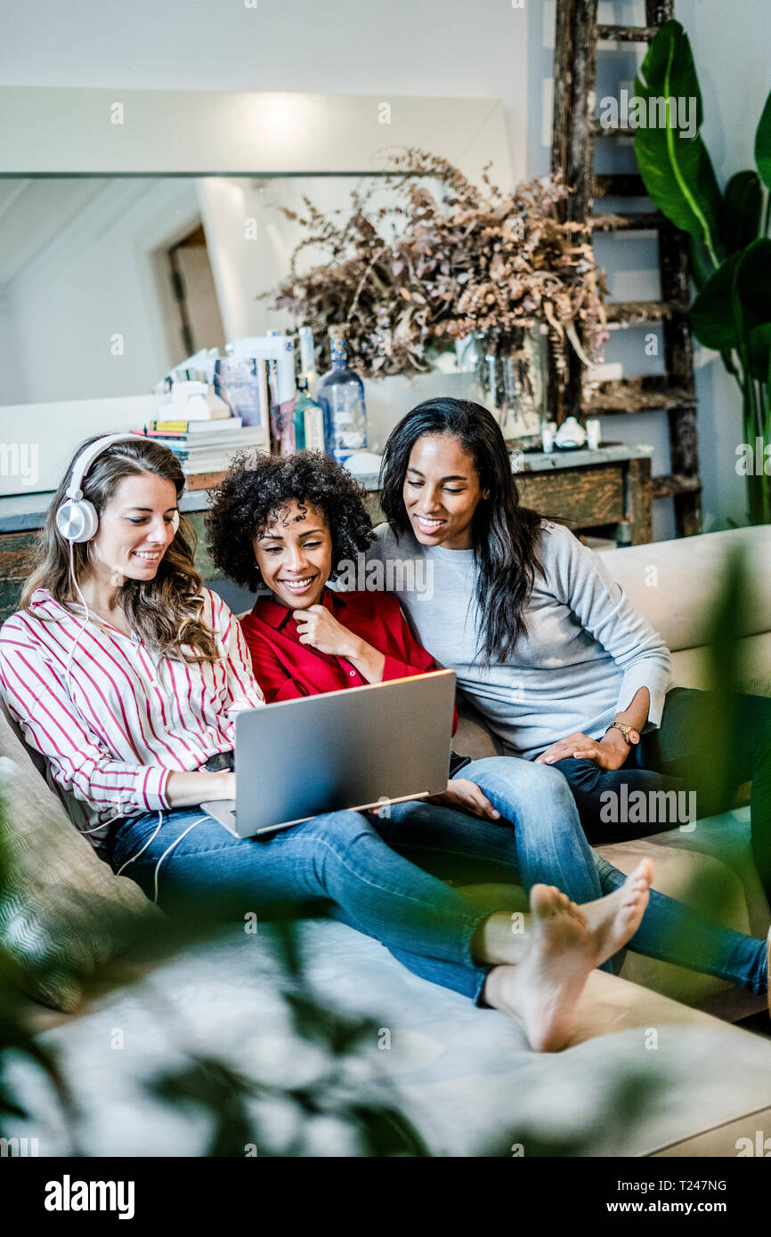 Three friends at home, living together Stock Photo - Alamy