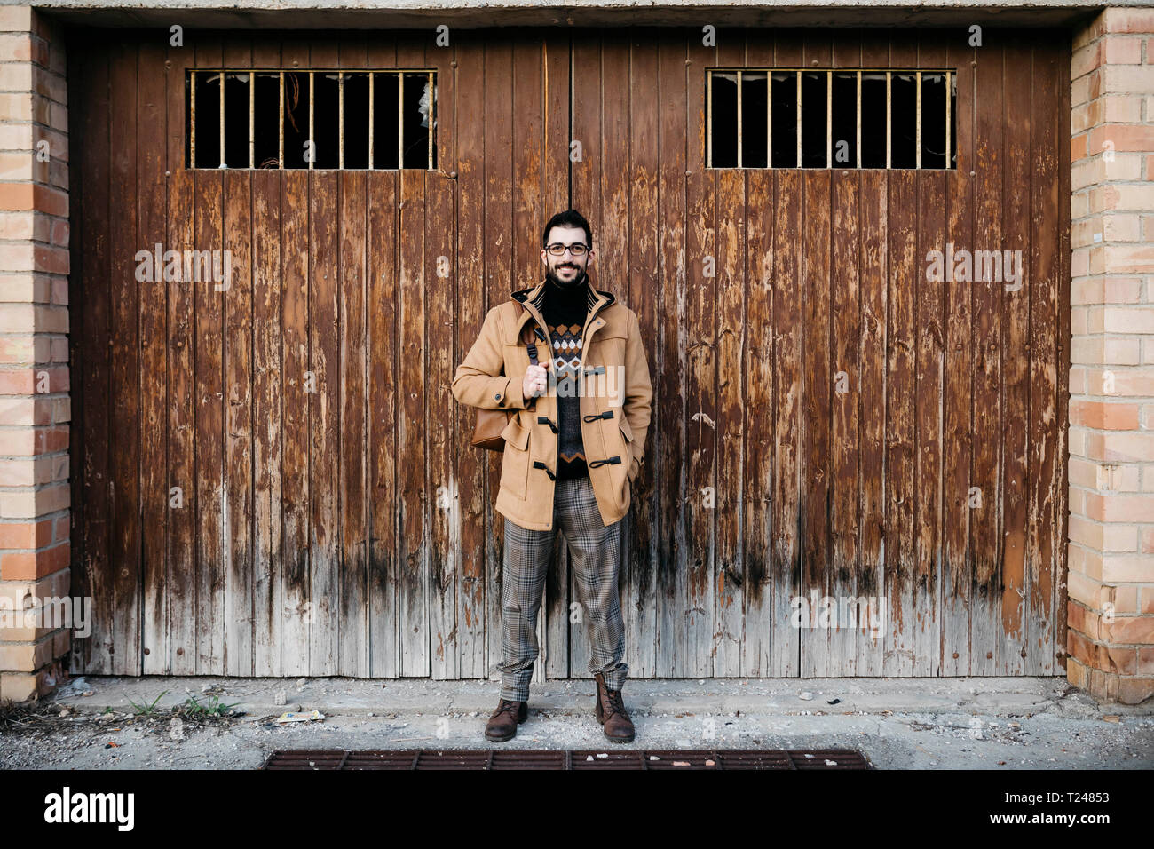 Portrait smiling man standing rundown wooden gate hi-res stock ...