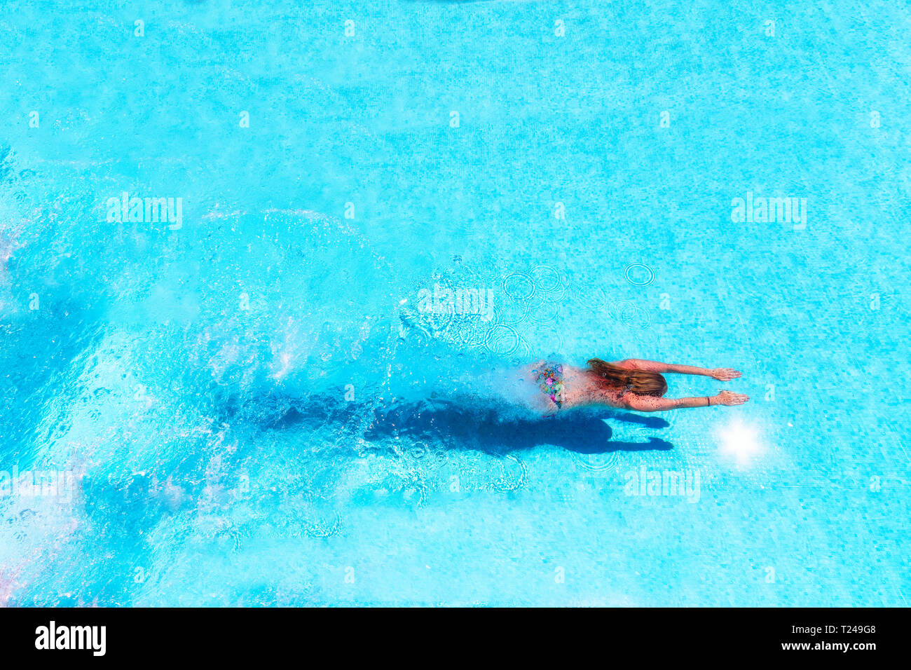 Woman diving into swimming pool hi-res stock photography and images - Alamy