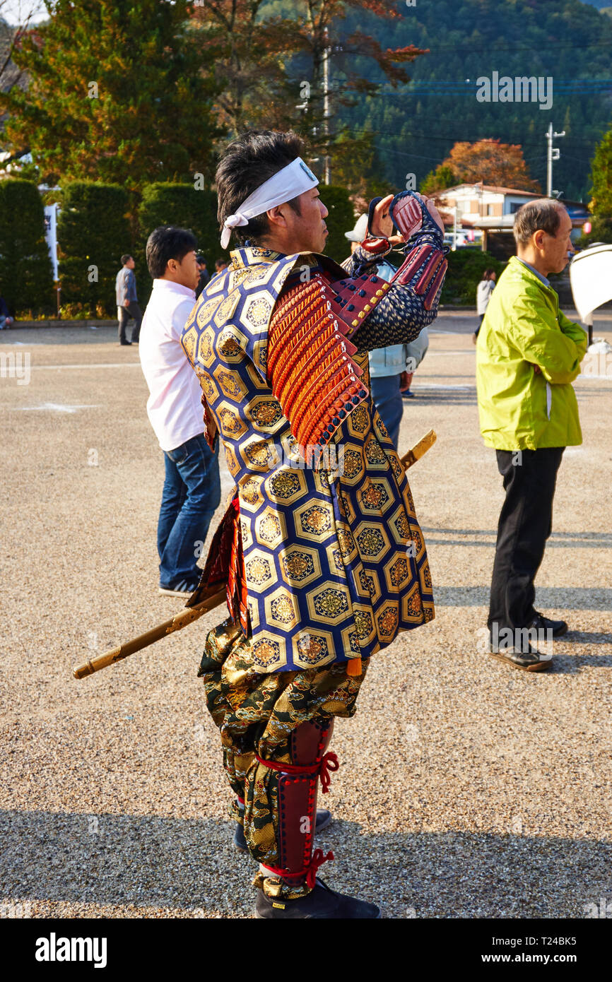 Japanese reenactor dressed as a samurai takes photograph during the ...