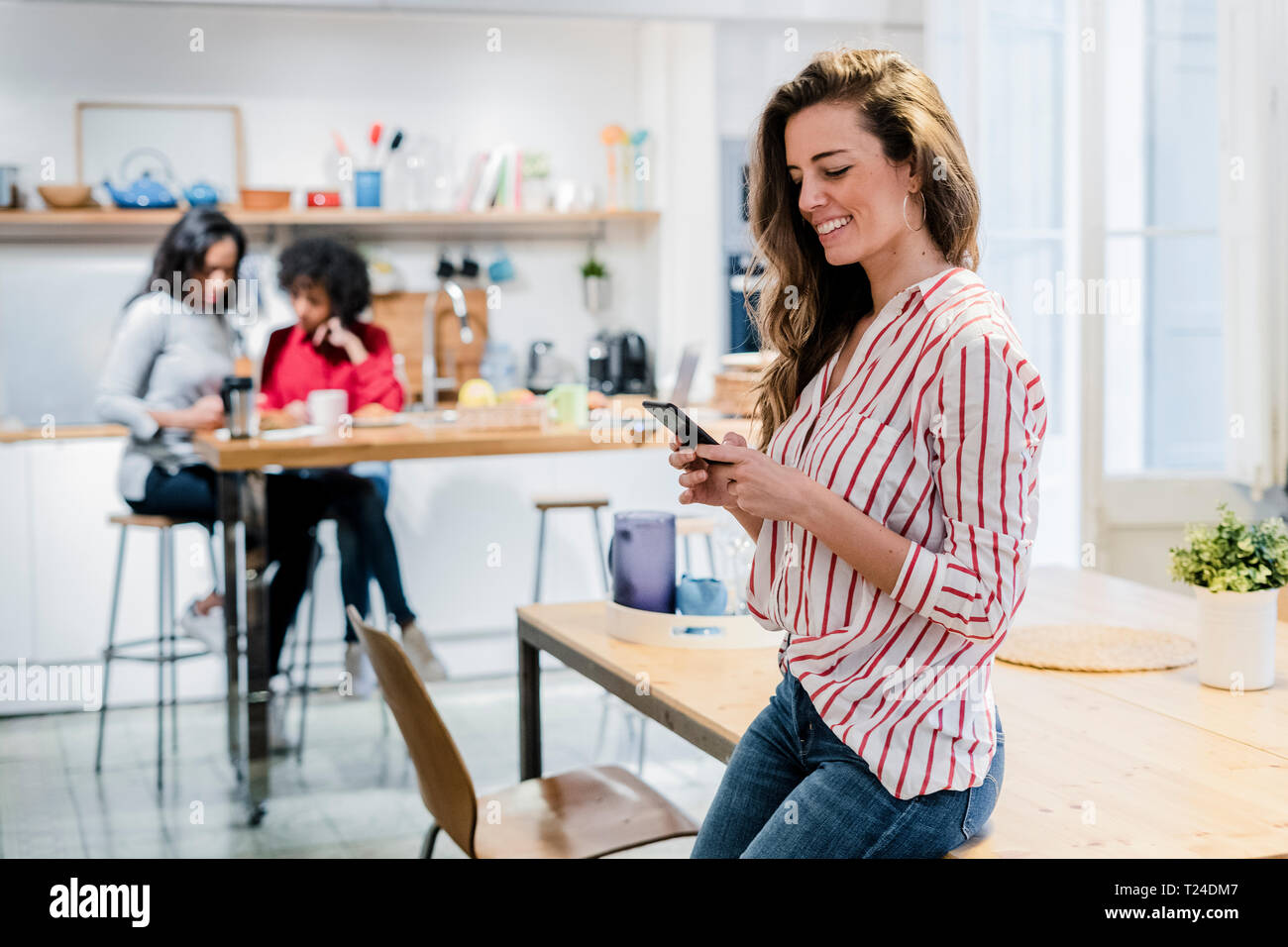 Three friends at home, living together Stock Photo - Alamy