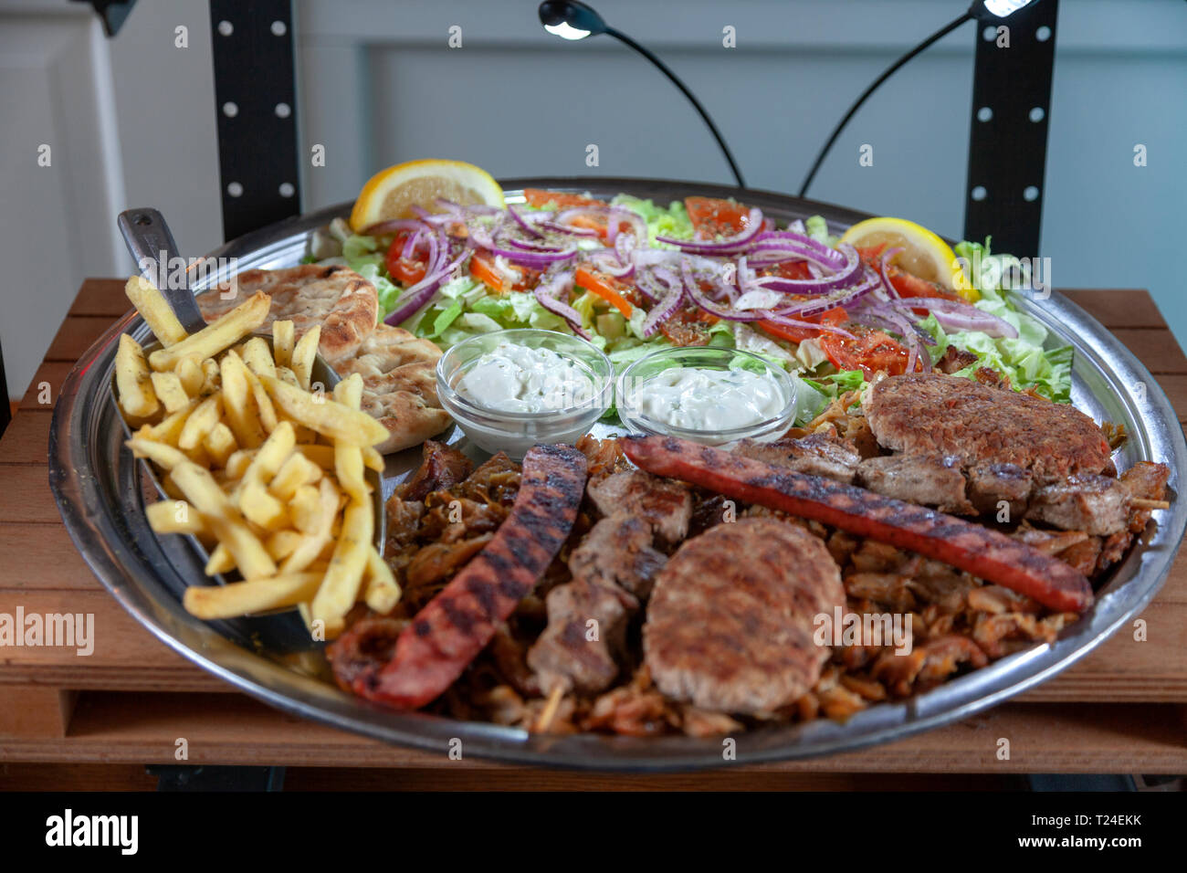 Greek style food,meats,gyros,salad,potatoes Stock Photo - Alamy
