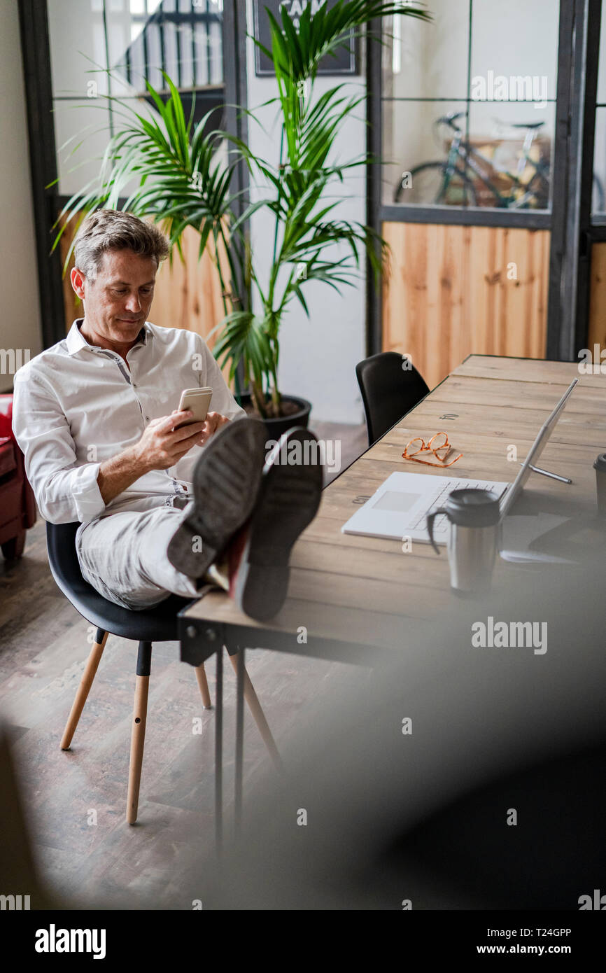 Feet desk phone hi-res stock photography and images - Alamy