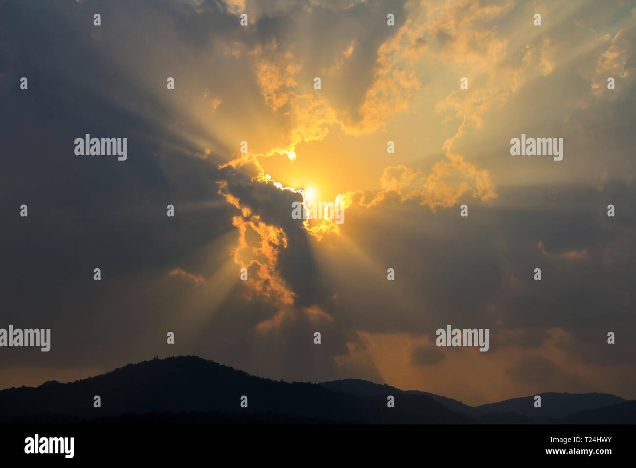 Beautiful sunrise or sunset with clouds and golden sunbeam over ...
