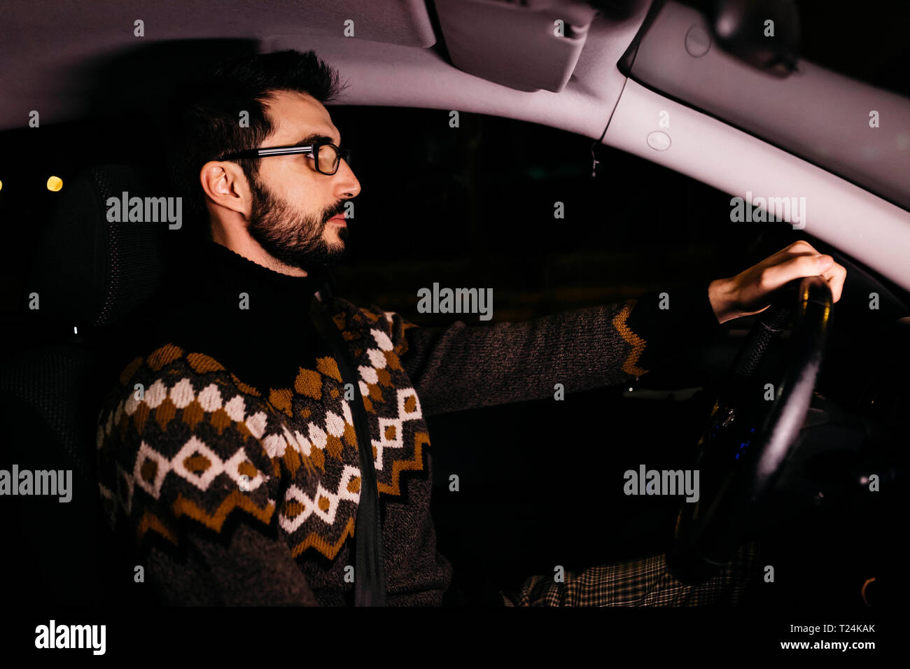 Man driving car at night Stock Photo - Alamy