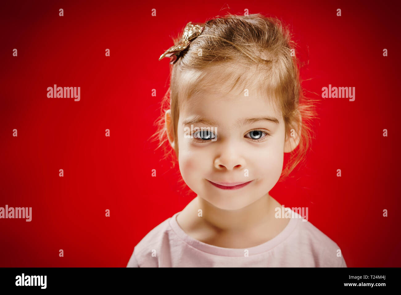 small and beautiful girl posing with a smile Stock Photo - Alamy