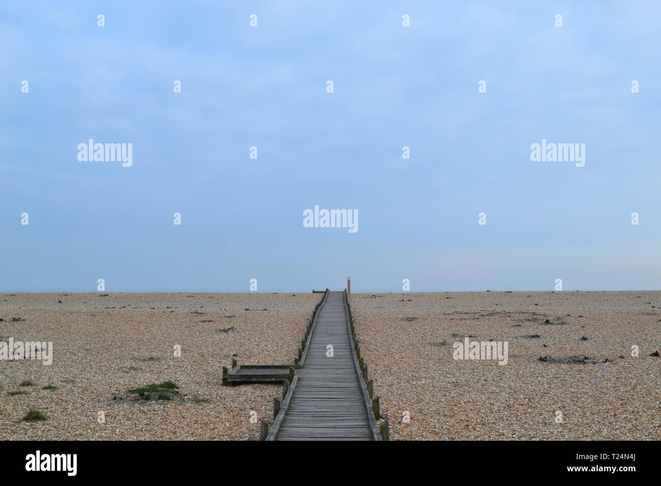 The boardwalk leading to the sea across the shingle at Dungeness, Kent ...