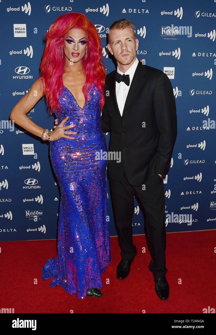 BEVERLY HILLS, CA - MARCH 28: Rhea Litré (L) and Daniel Newman attend ...