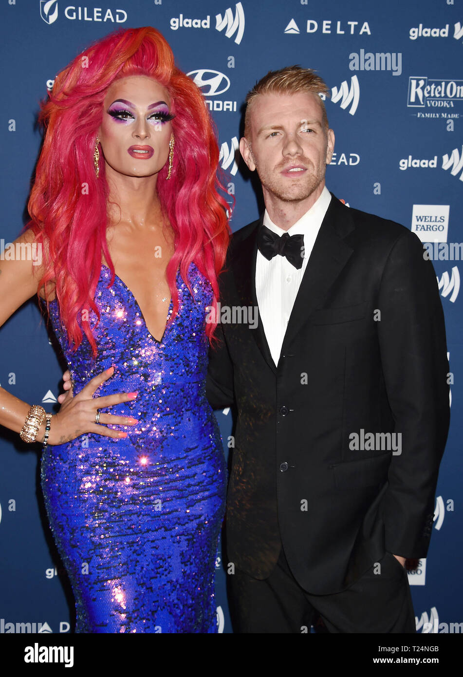 BEVERLY HILLS, CA - MARCH 28: Rhea Litré (L) and Daniel Newman attend ...