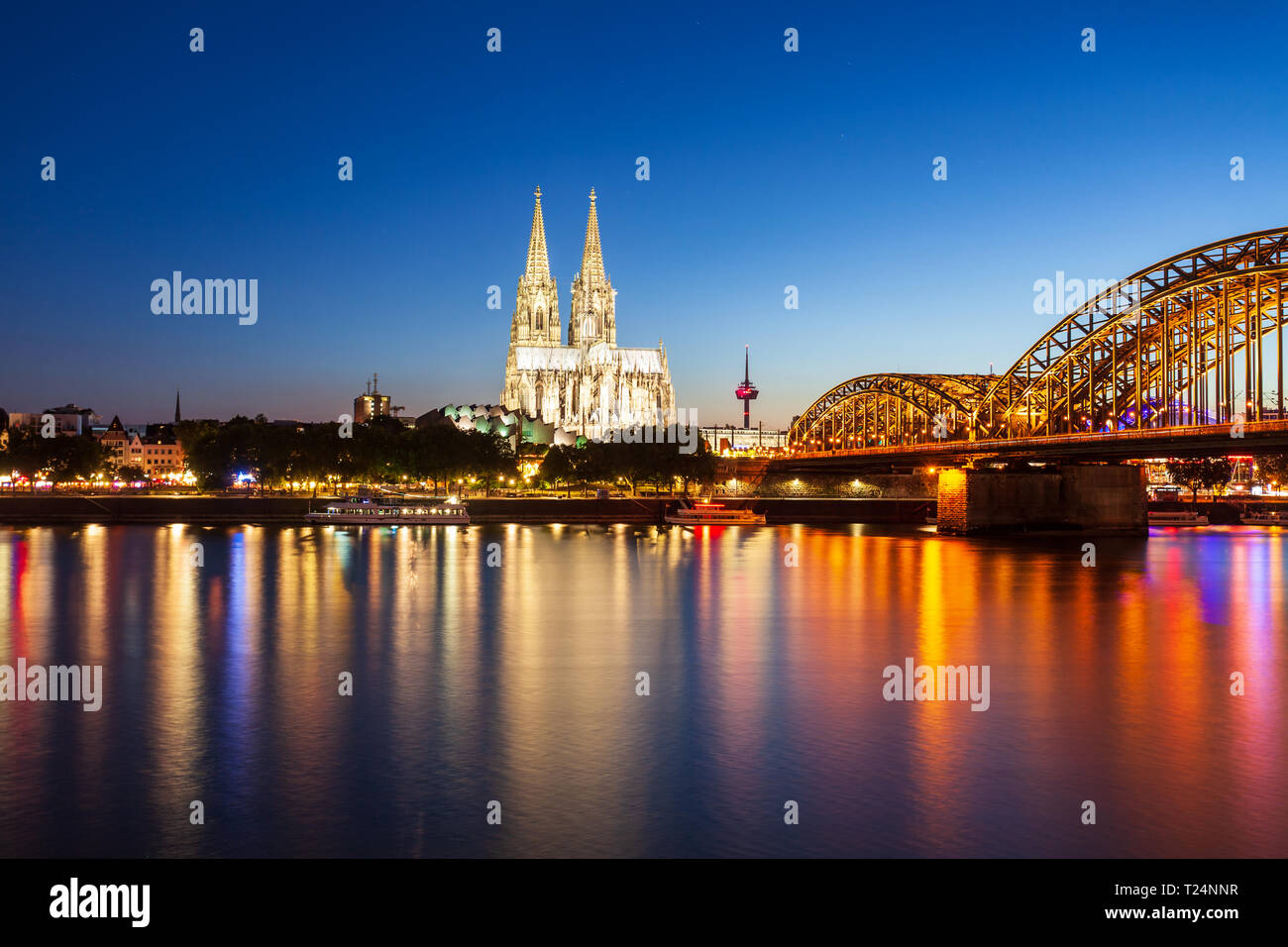 Cologne Cathedral and Hohenzollern Bridge through Rhine river in ...