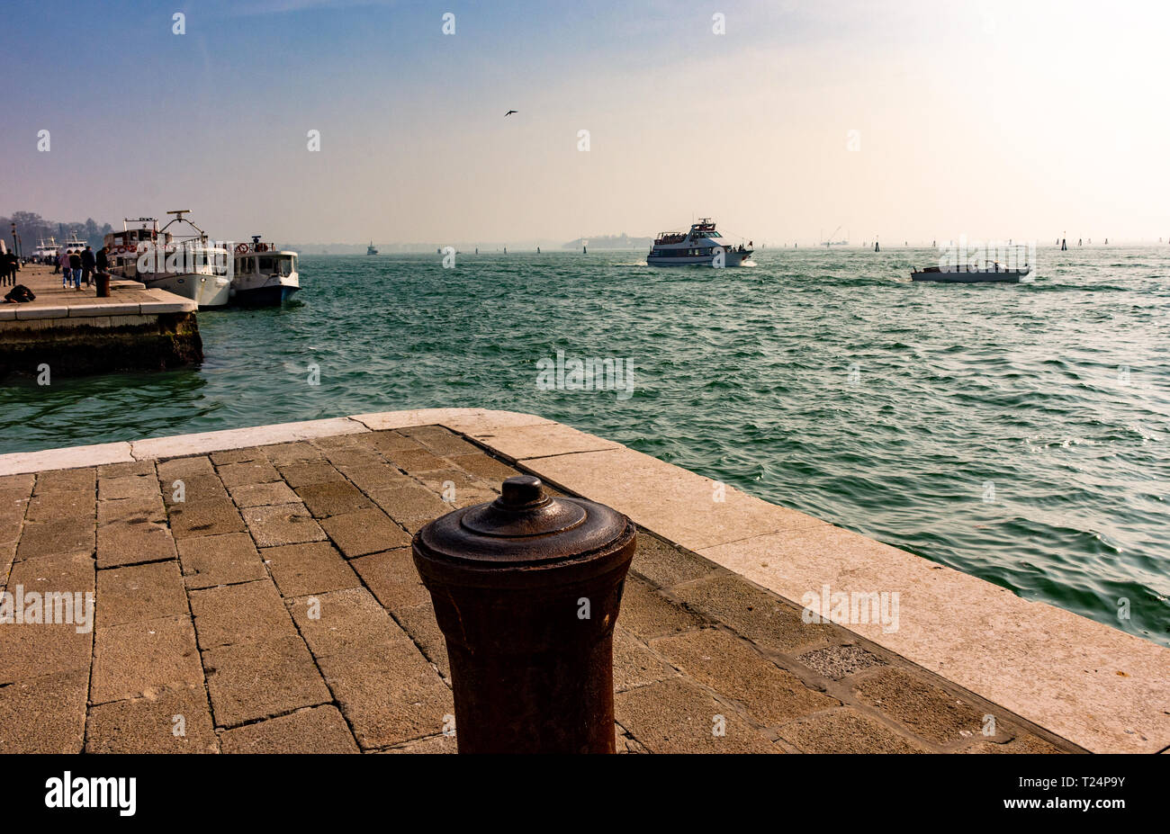 Italy, Venice, bollard for mooring ferries Stock Photo - Alamy