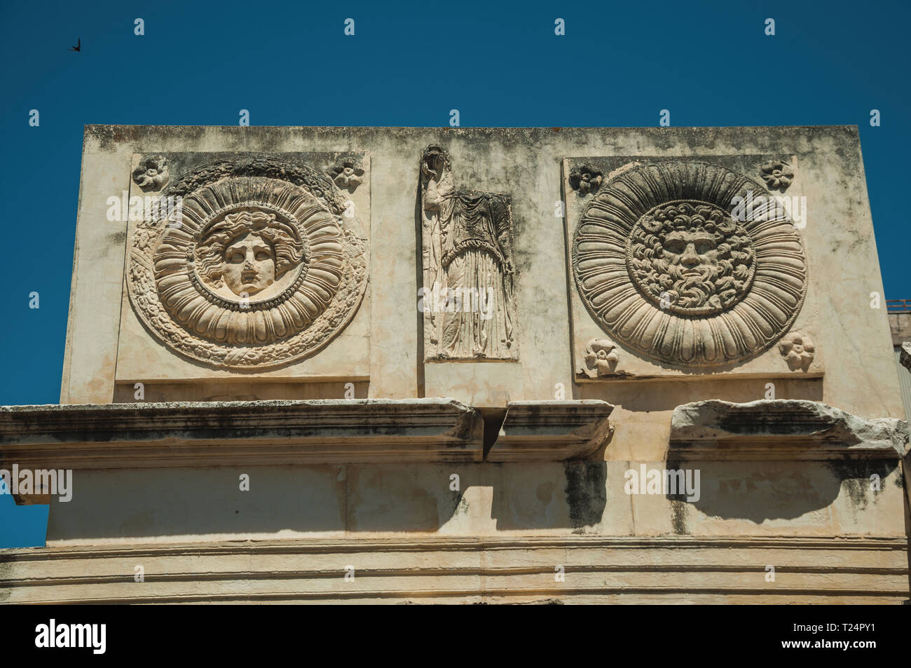 Greek-Roman mythological face carved in marble block at the Roman Forum ...