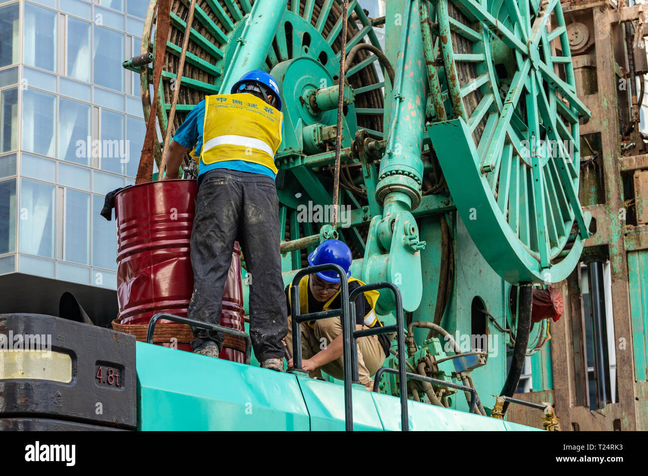 Collaboration between two workers in China Stock Photo - Alamy
