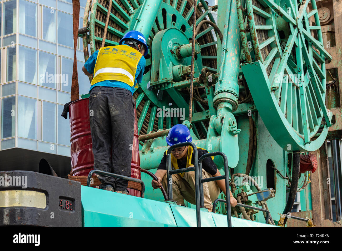 Collaboration between two workers in China Stock Photo - Alamy