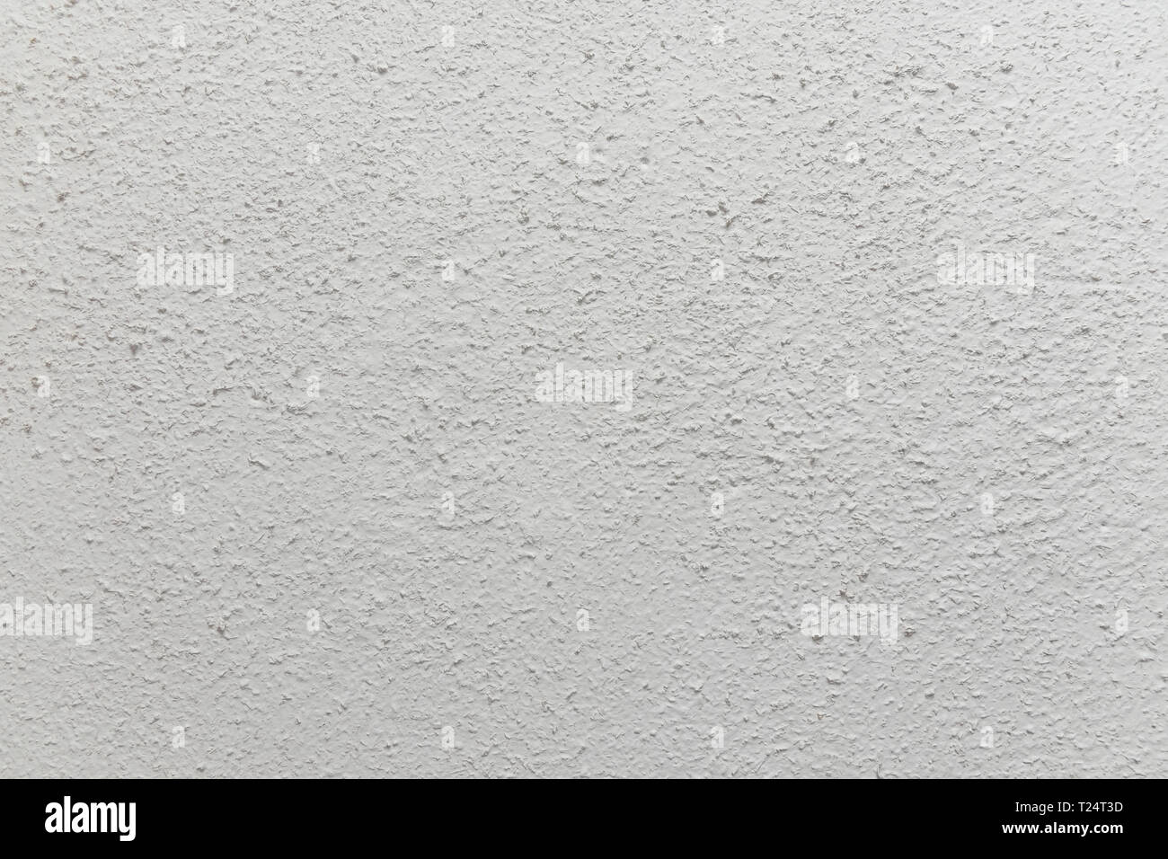 Surface of grey rugged wall in close-up as a texture or background ...
