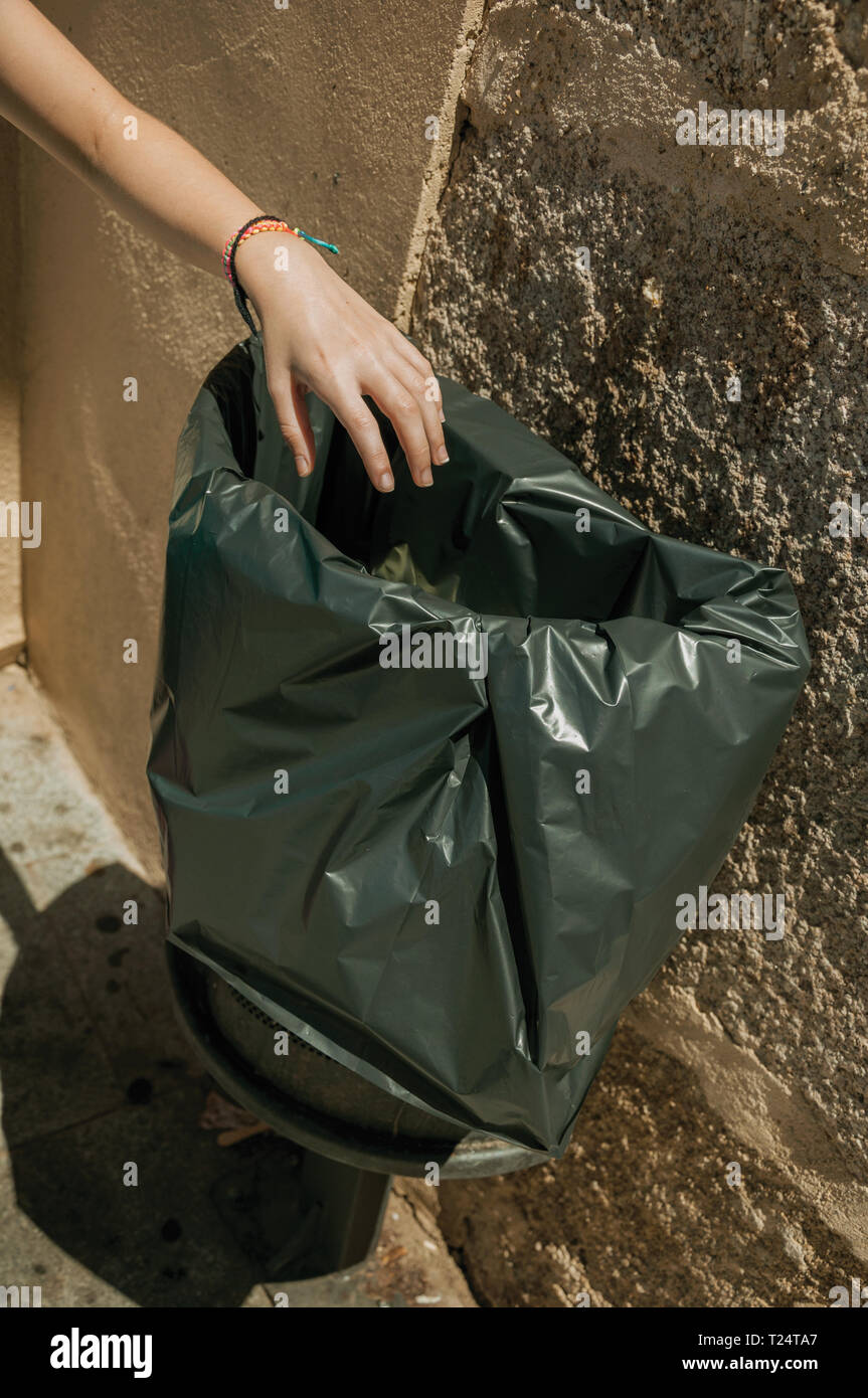Girl throwing garbage hi-res stock photography and images - Alamy