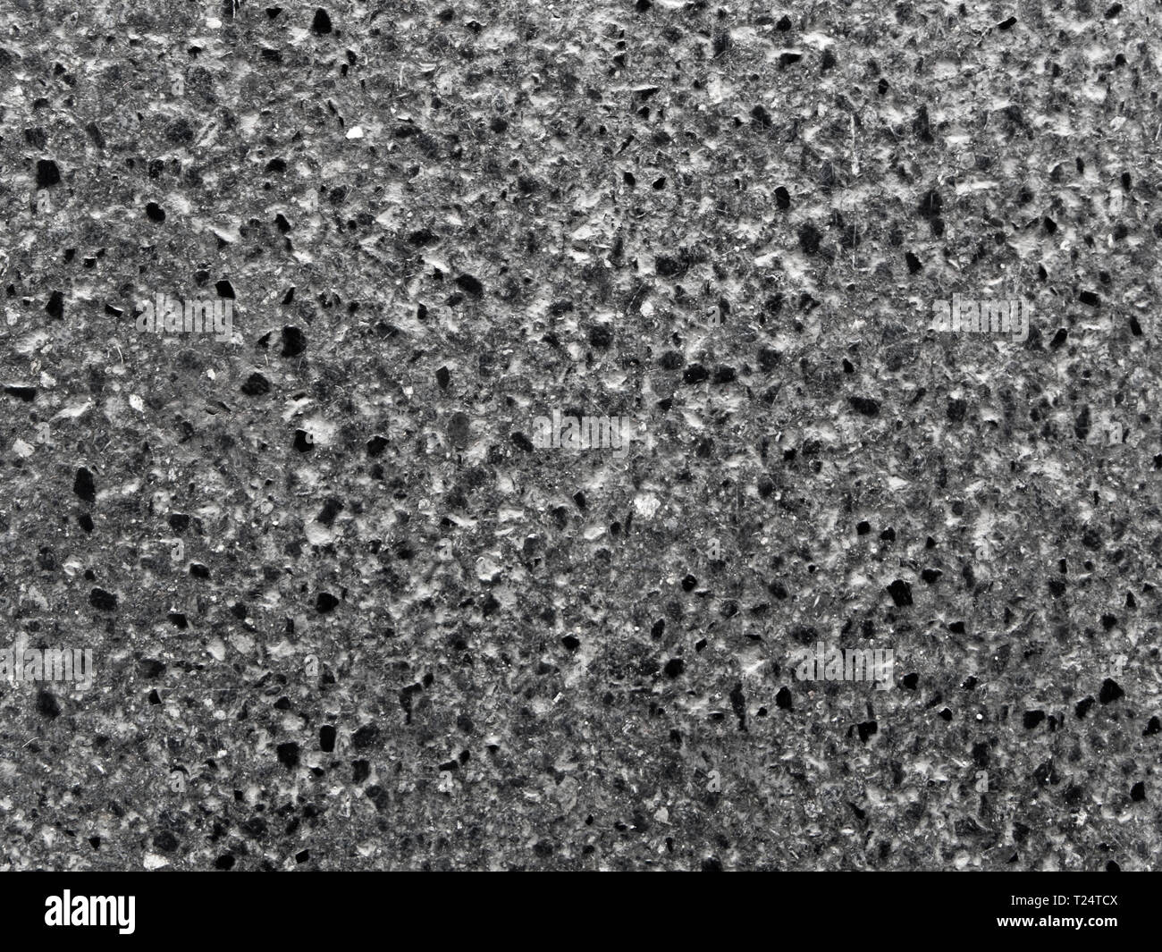 Small black rock in Rough Concrete floor Stock Photo - Alamy