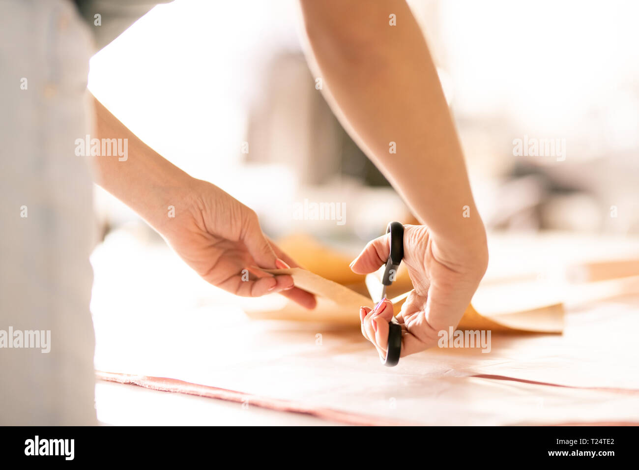 Woman bending over table hi-res stock photography and images - Alamy