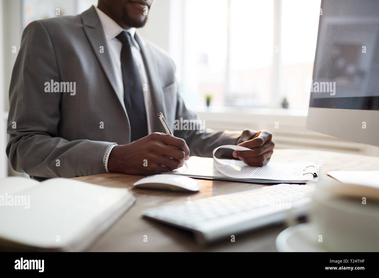 African american businessman signing documents hi-res stock photography ...