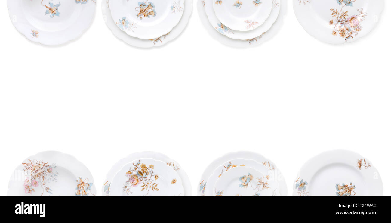 Set of antique decorated porcelain plates isolated on white. Template ...