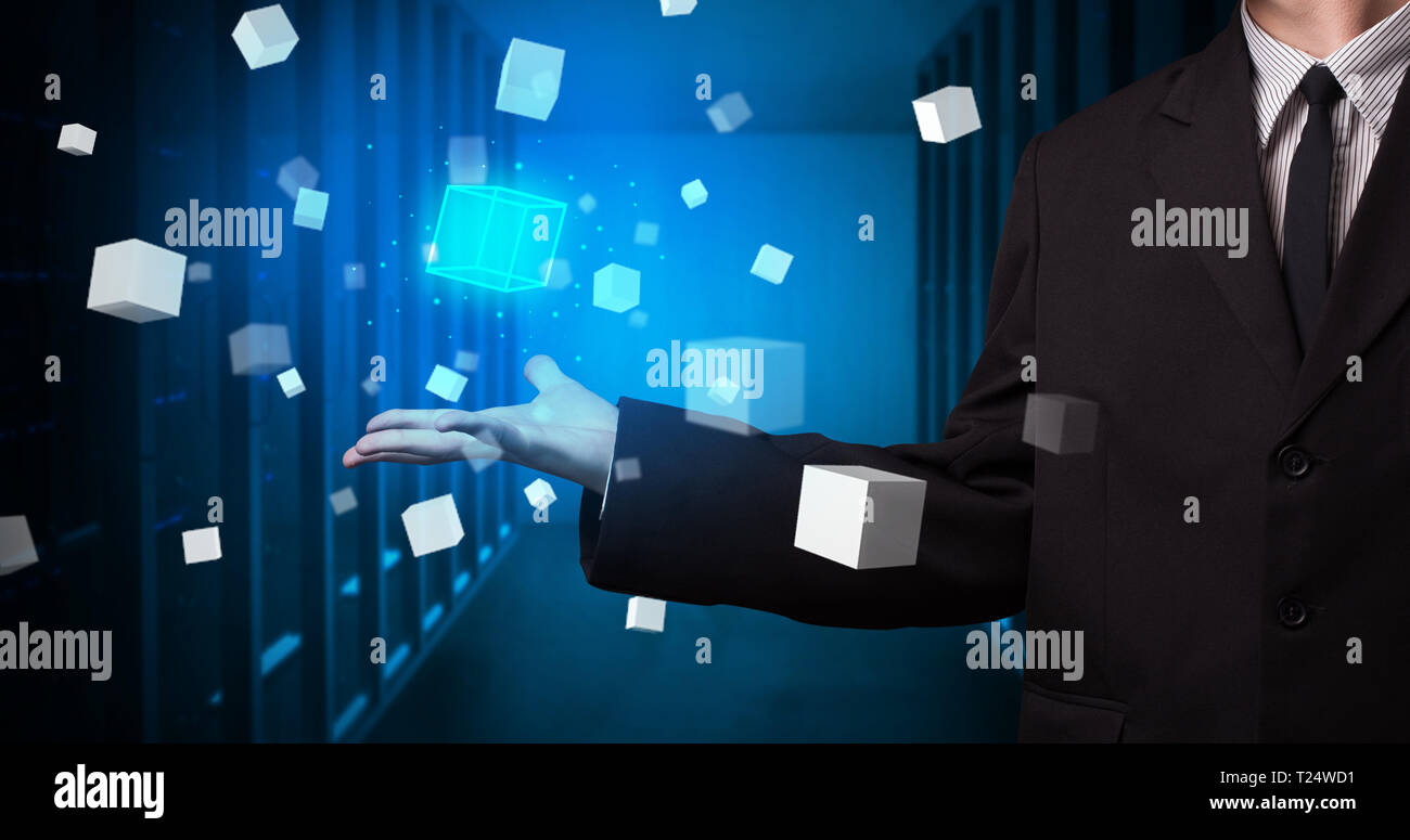 Person holding hologram projection displaying white cubes in server ...