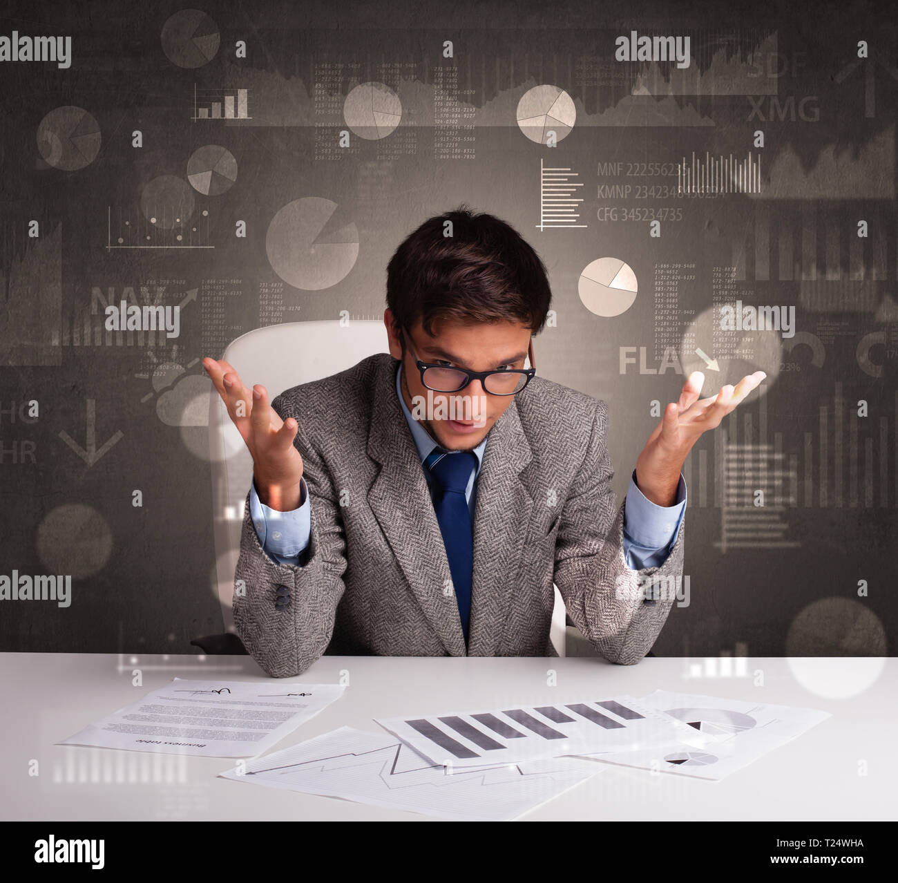 Young manager at the office making report and statistics with ...