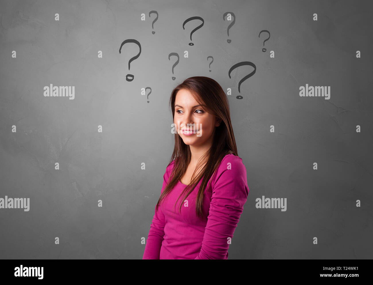 Person with question marks around face Stock Photo - Alamy