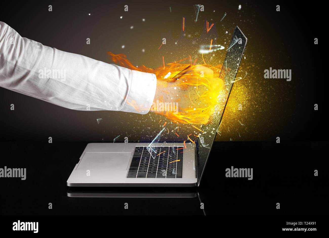 Firing hand hitting strongly laptop screen glass Stock Photo - Alamy