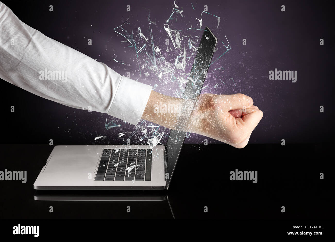 Hand hitting strongly laptop screen glass Stock Photo - Alamy