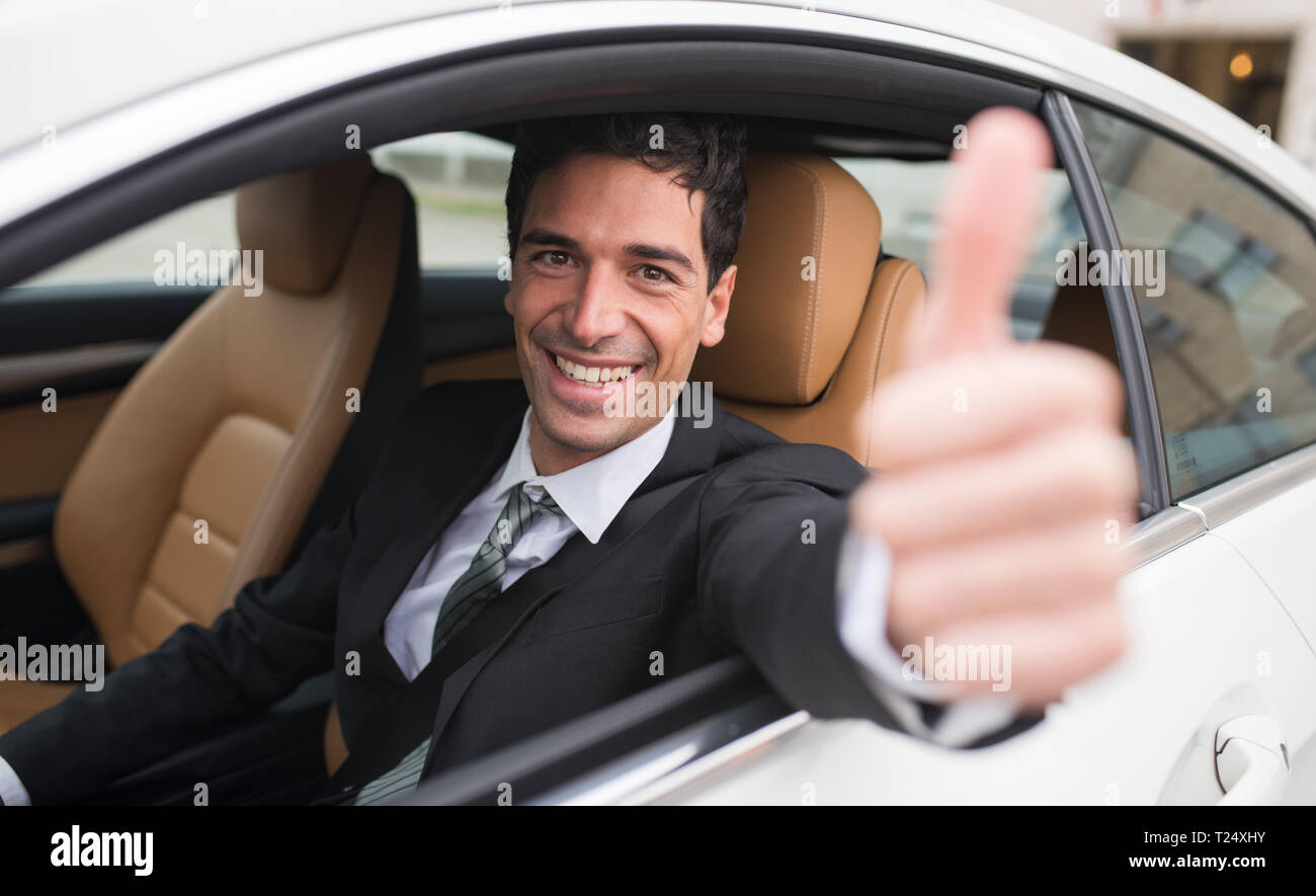 Car driver thumbs up Stock Photo - Alamy