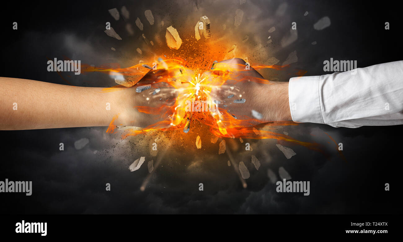 Two hands fighting and breaking a rock into small pieces Stock Photo ...
